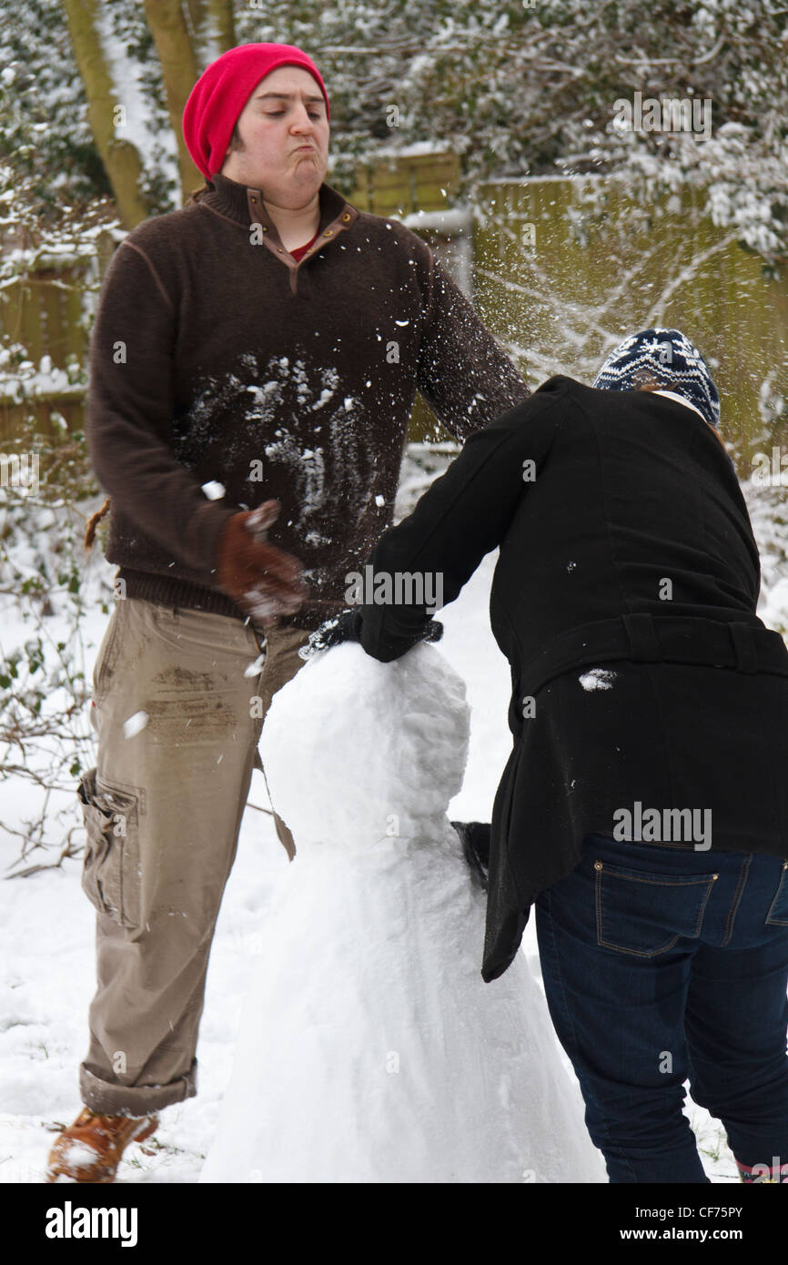 Building a snowman england hi-res stock photography and images - Alamy
