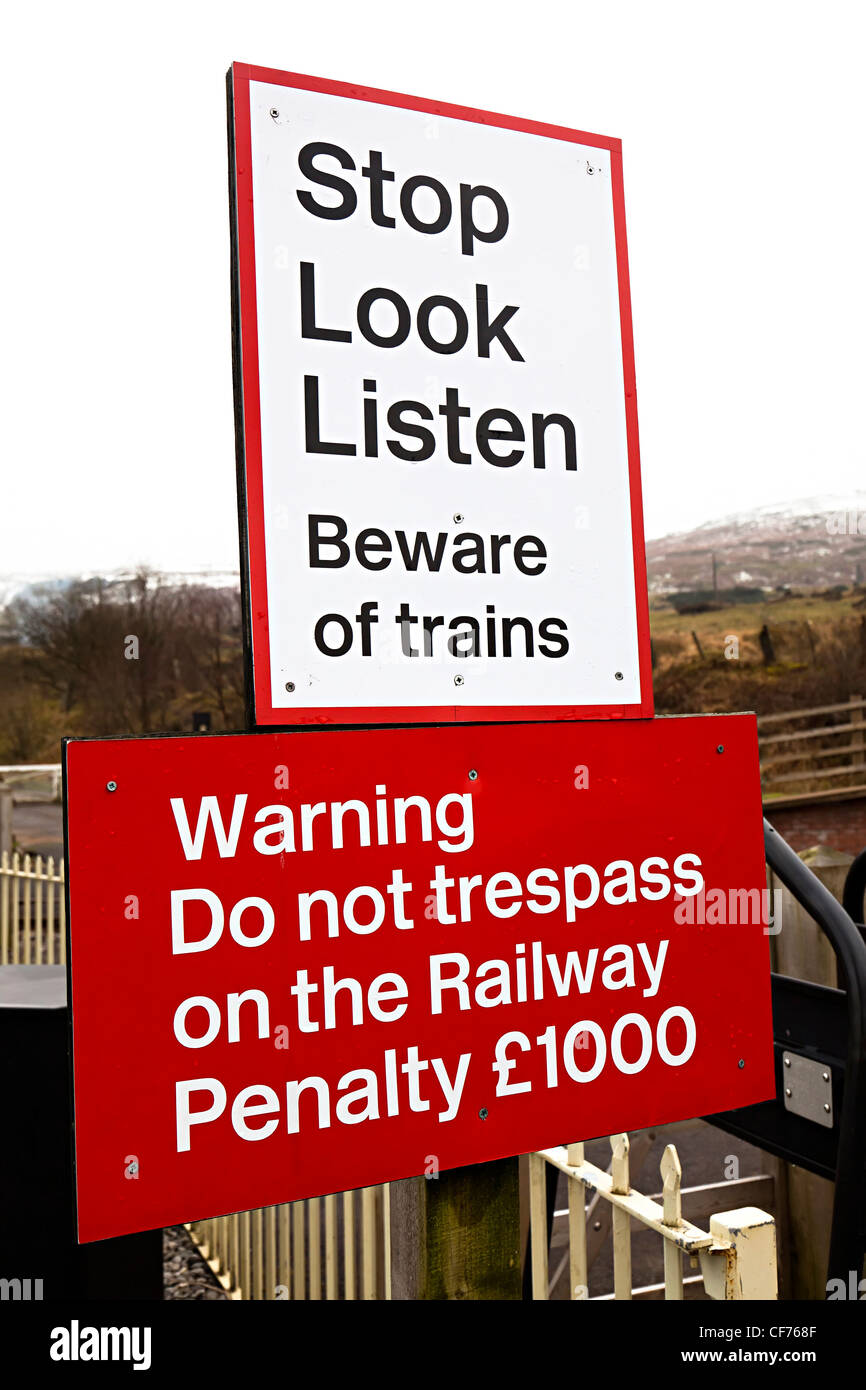 Stop look listen beware of trains sign and no trespassing on the ...