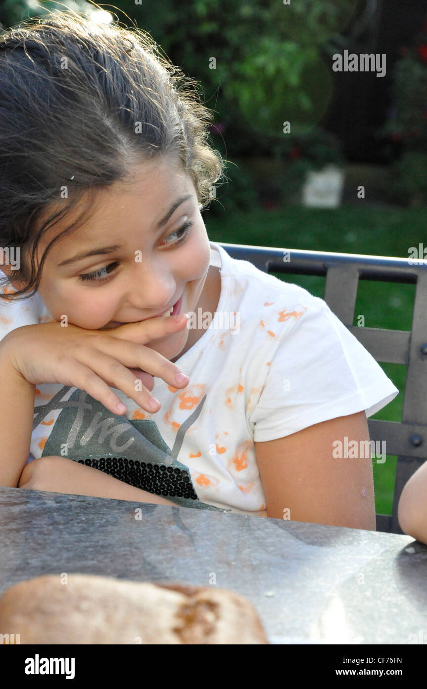 Young girl smiles in reaction Stock Photo - Alamy