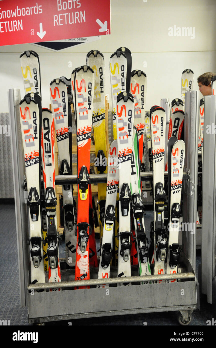 Skis in rack display Stock Photo - Alamy