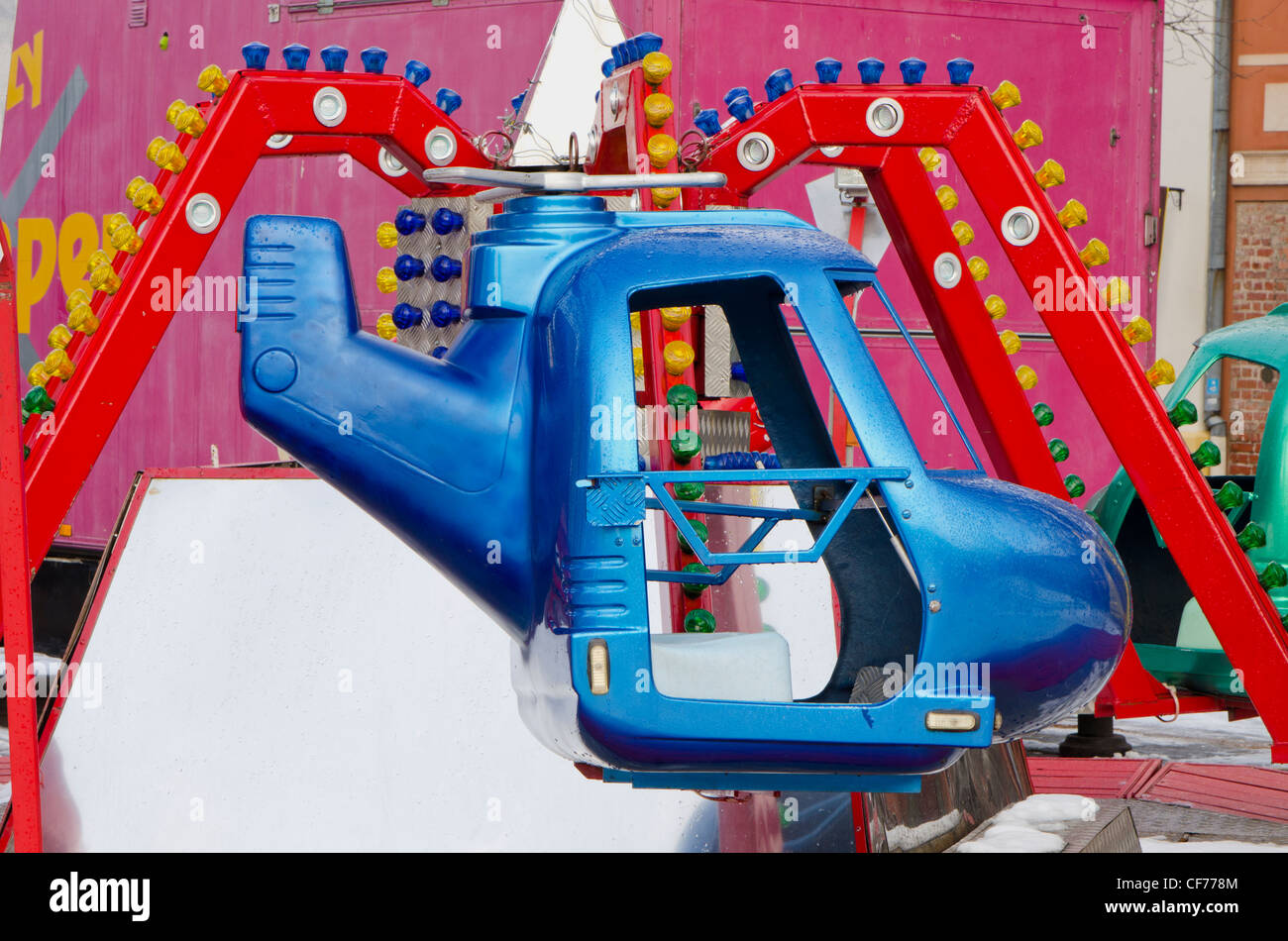 Amusement park rides colorful carousel spin helicopter Stock Photo - Alamy