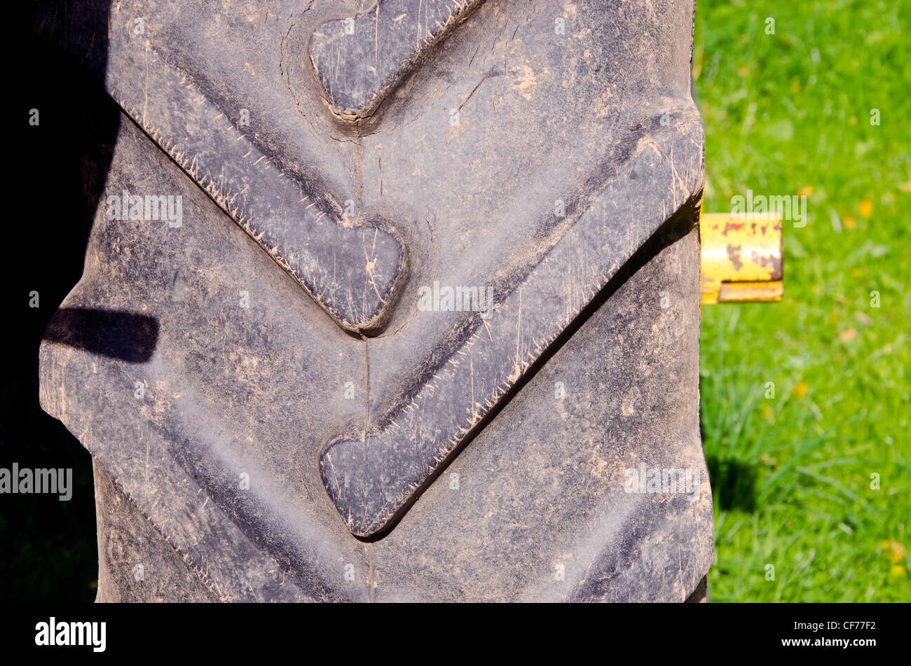 Tractor tire protector closeup background. Agricultural machinery part ...