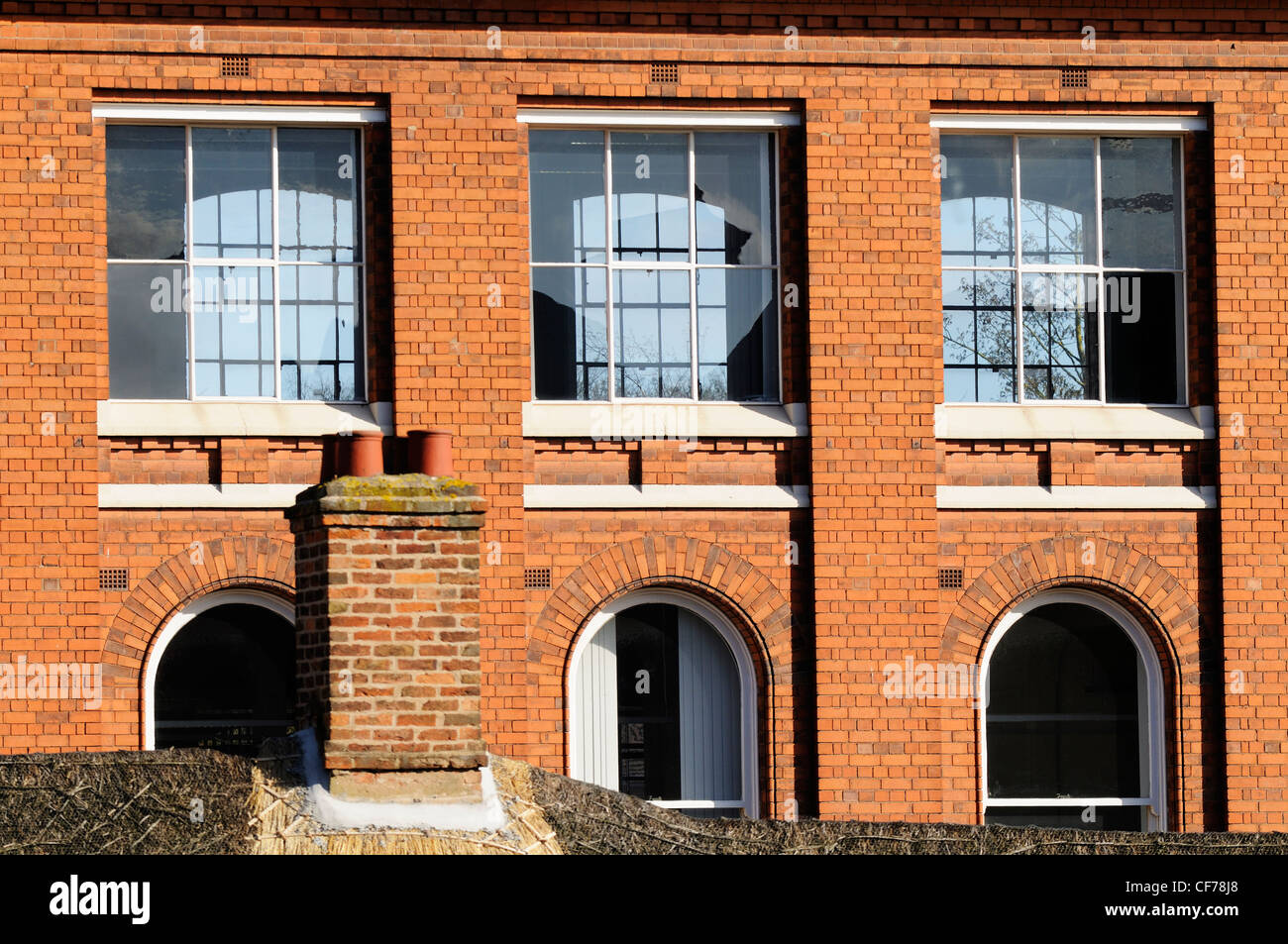 Square and Arched windows in an old brick factory Stock Photo - Alamy