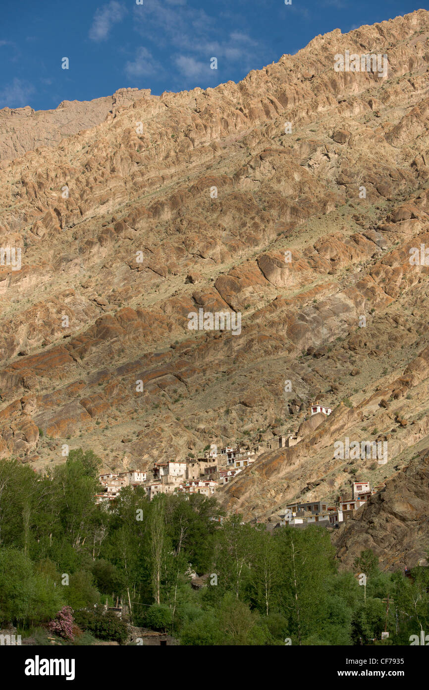 Village built into the foot of a cliff, near Hemis Gompa, (Ladakh ...