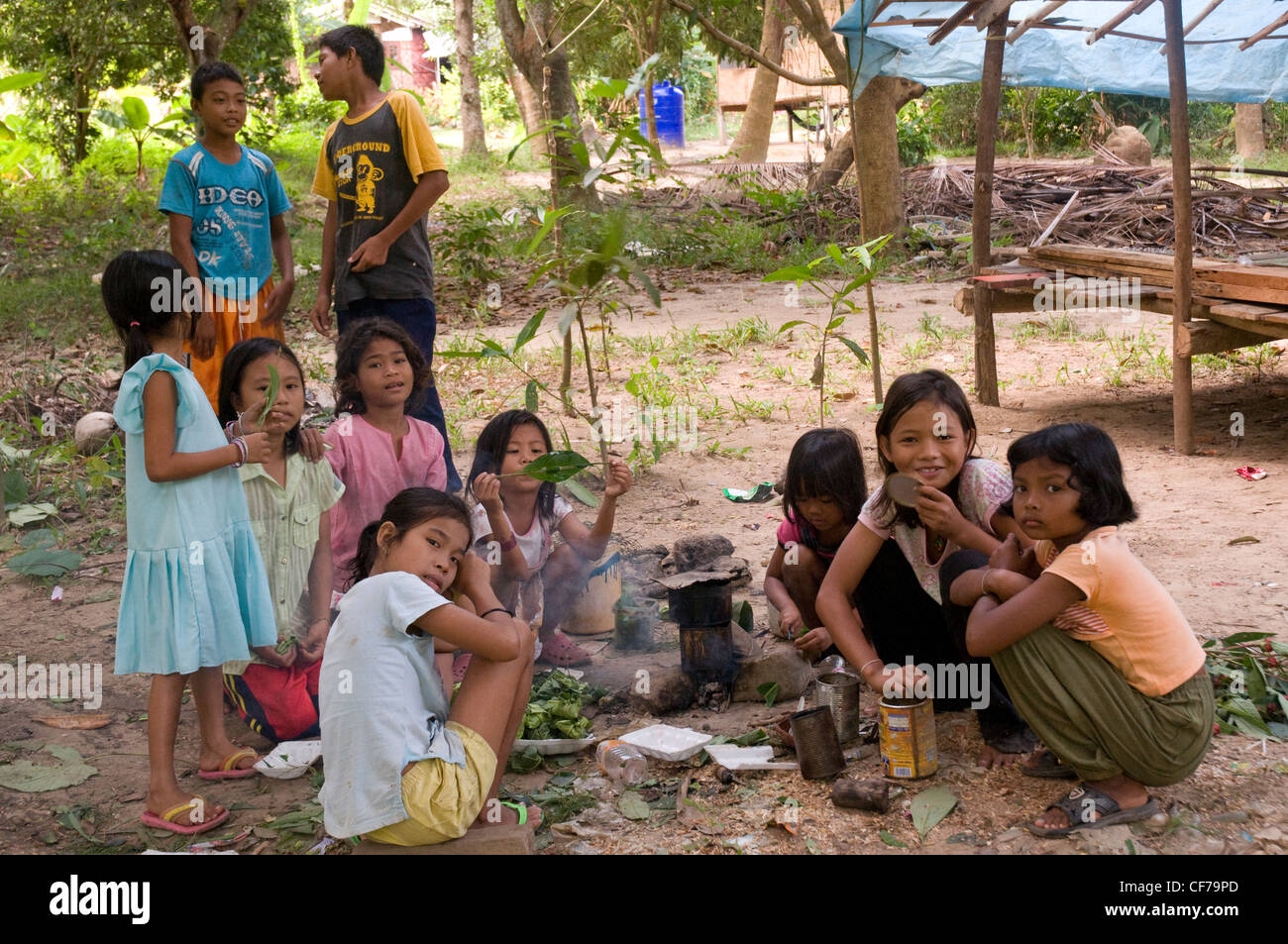 Thai Children cooking outside on the Beach at Koh Bulon, Thailand Stock ...