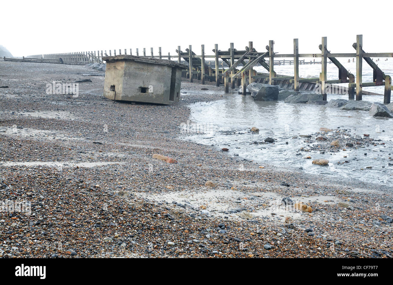 A world war two pillbox on the beach at Happisburgh after erosion ...