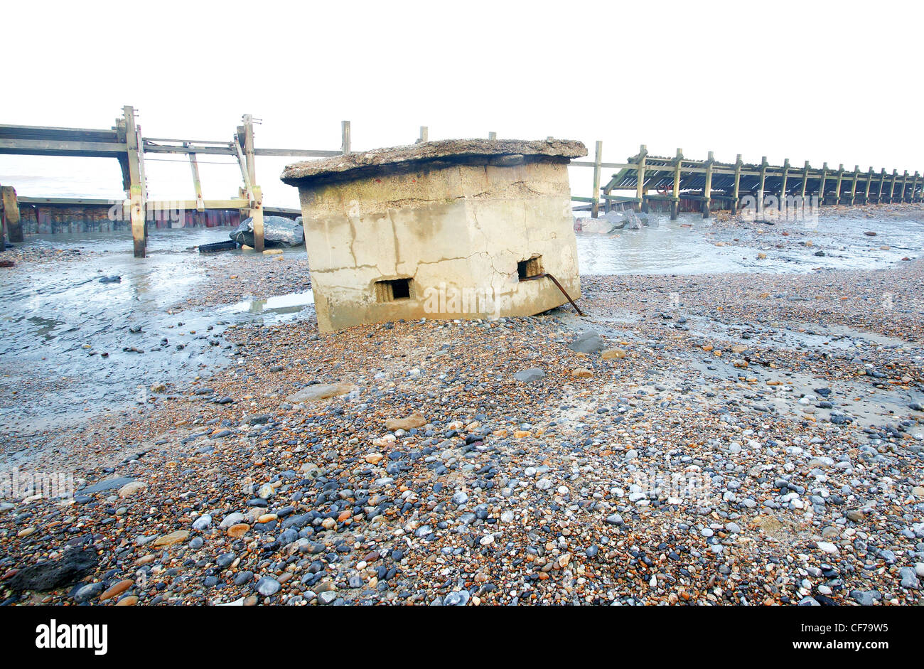 A world war two pillbox on the beach at Happisburgh after erosion ...