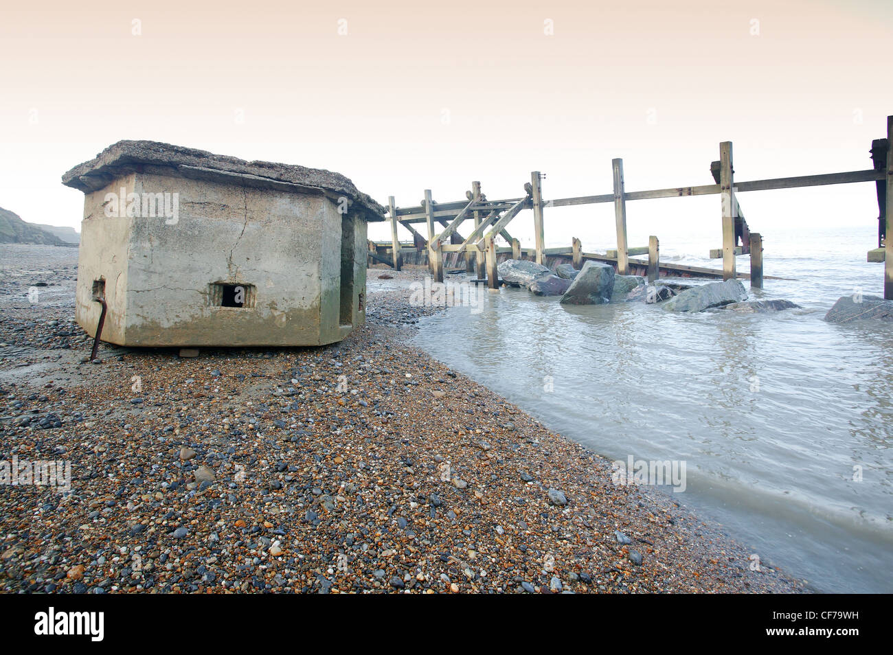 A world war two pillbox on the beach at Happisburgh after erosion ...