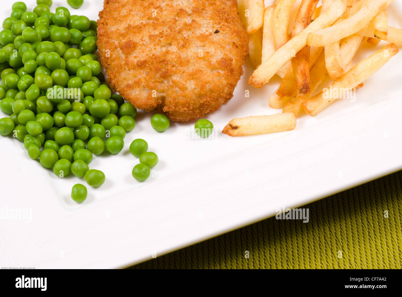 Fish and chips, battered hake with garnish Stock Photo - Alamy