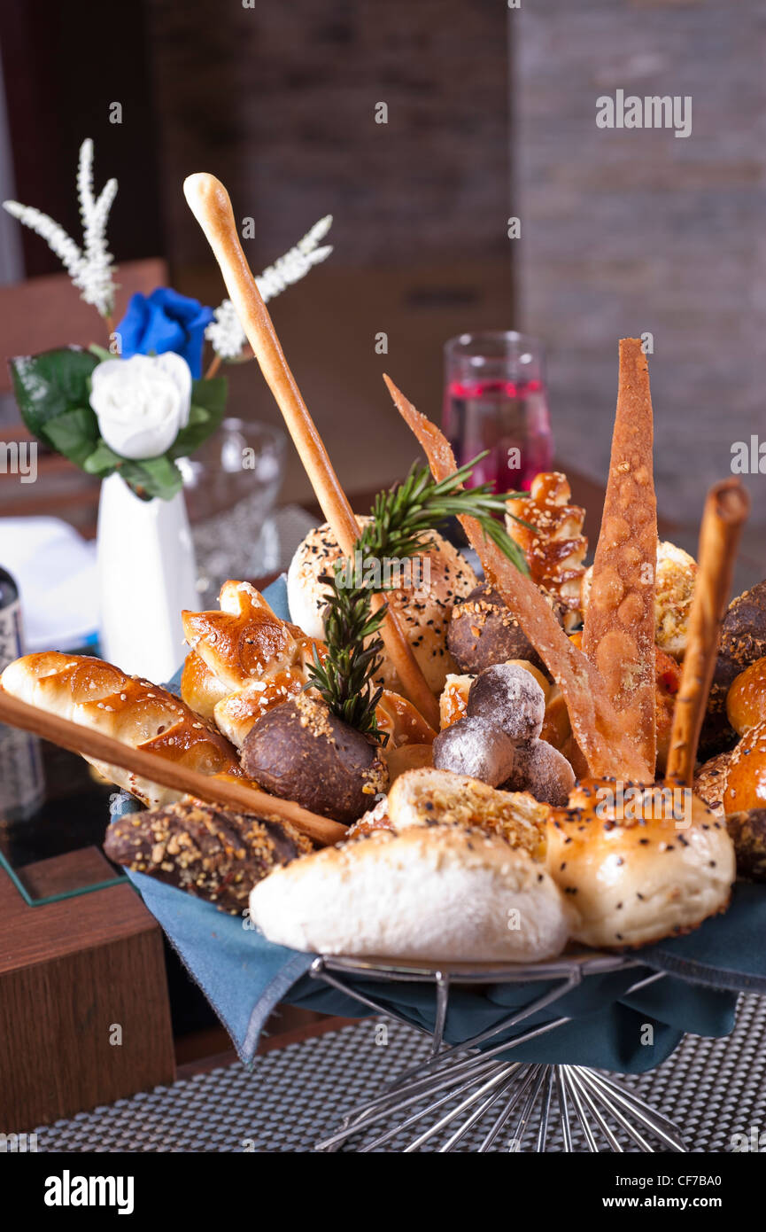 Luxury bread basket display in an a la carte restaurant Stock Photo - Alamy
