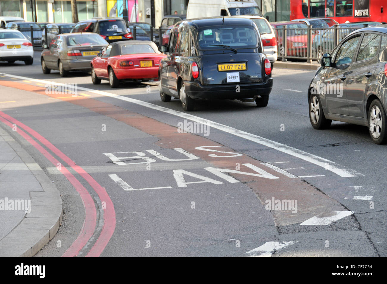 Bus lane London Red route traffic black cab taxi cars congestion ...