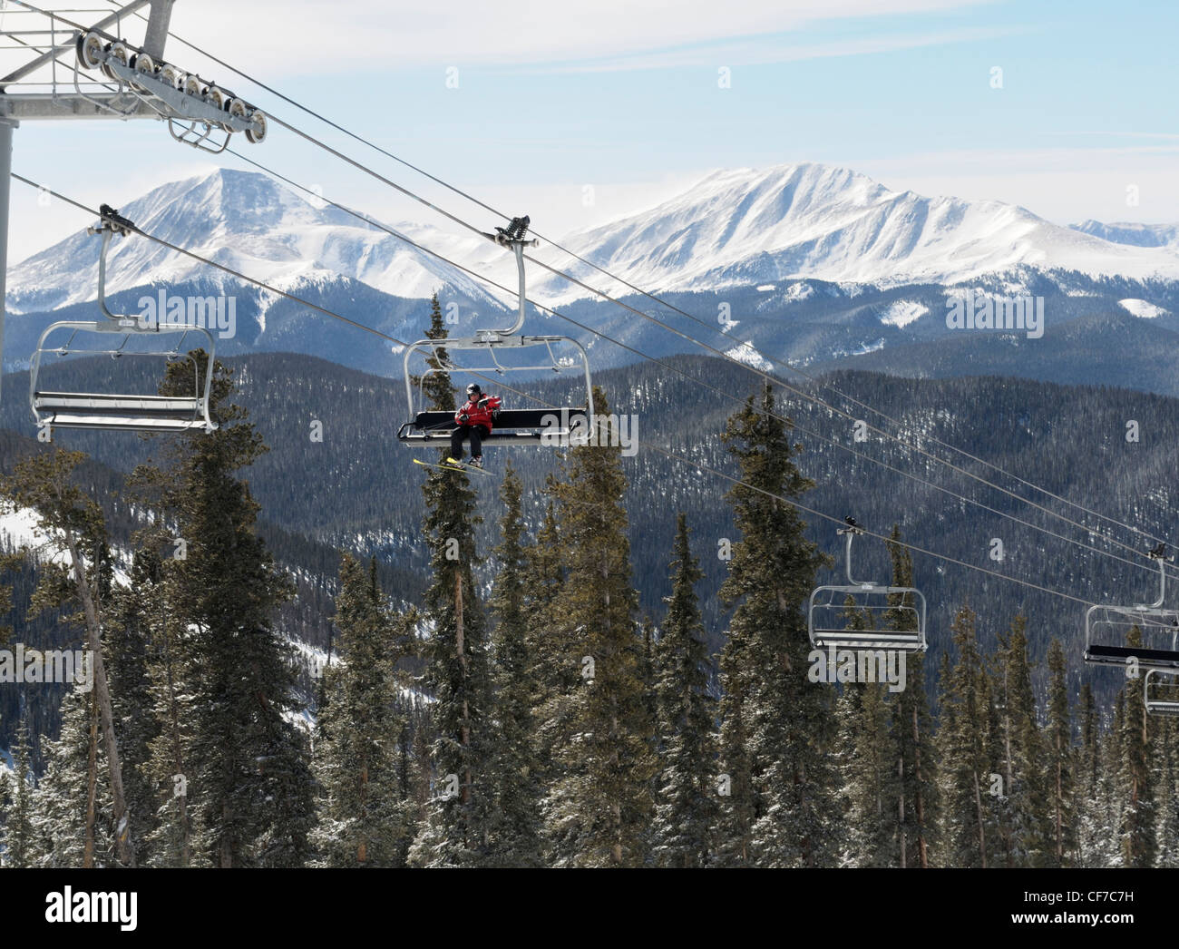 Chairlift bringing lone skier to the summit, Keystone Resort, Colorado ...