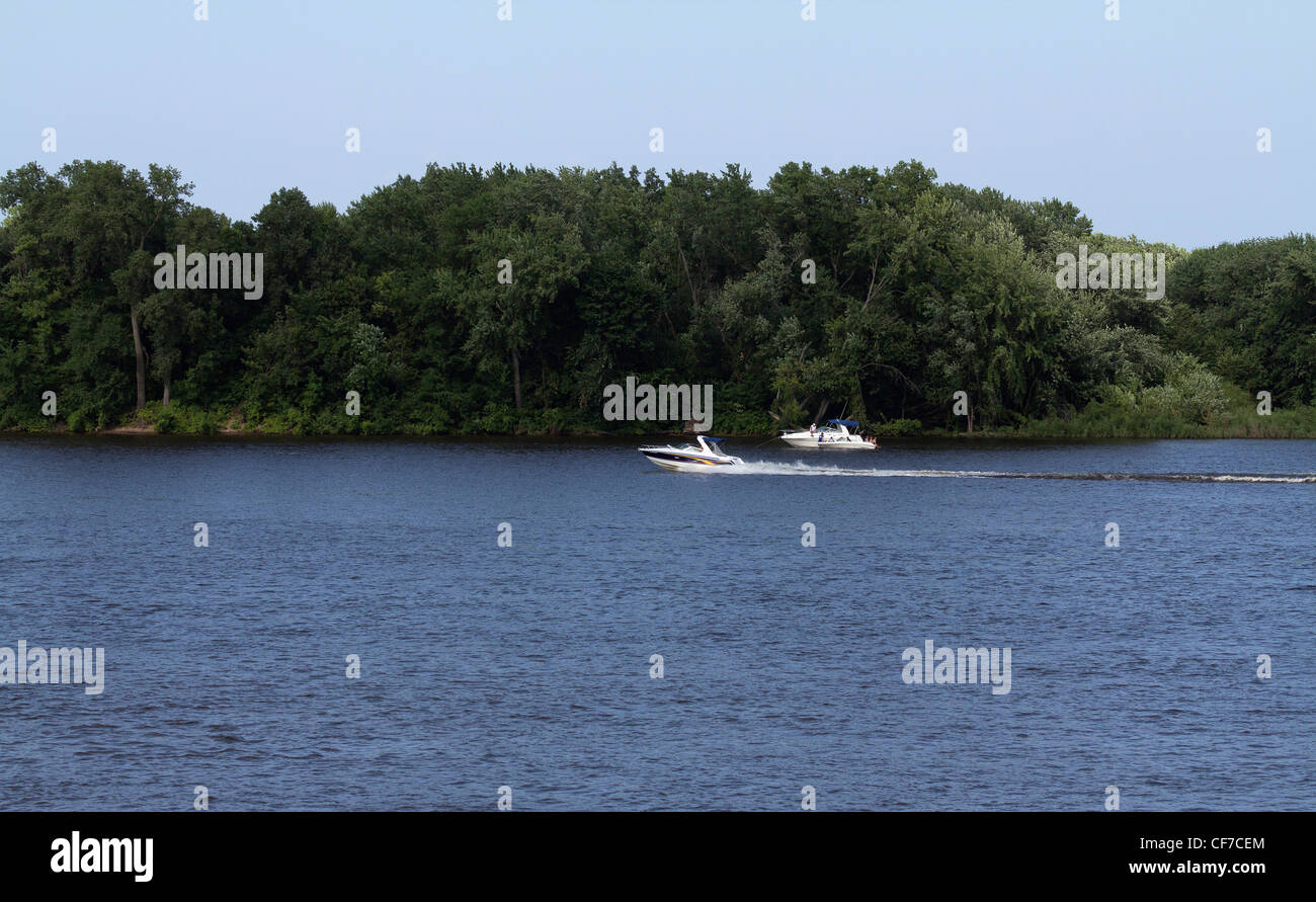 A boat with tourists sails down the river at Mississippi River ...