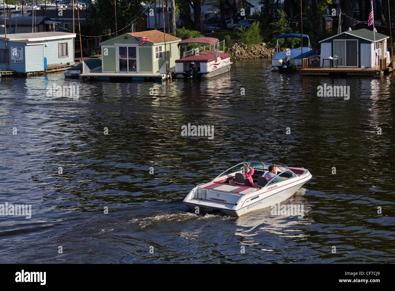 A motor boat with tourists sails down the river in Wisconsin La Crosse ...