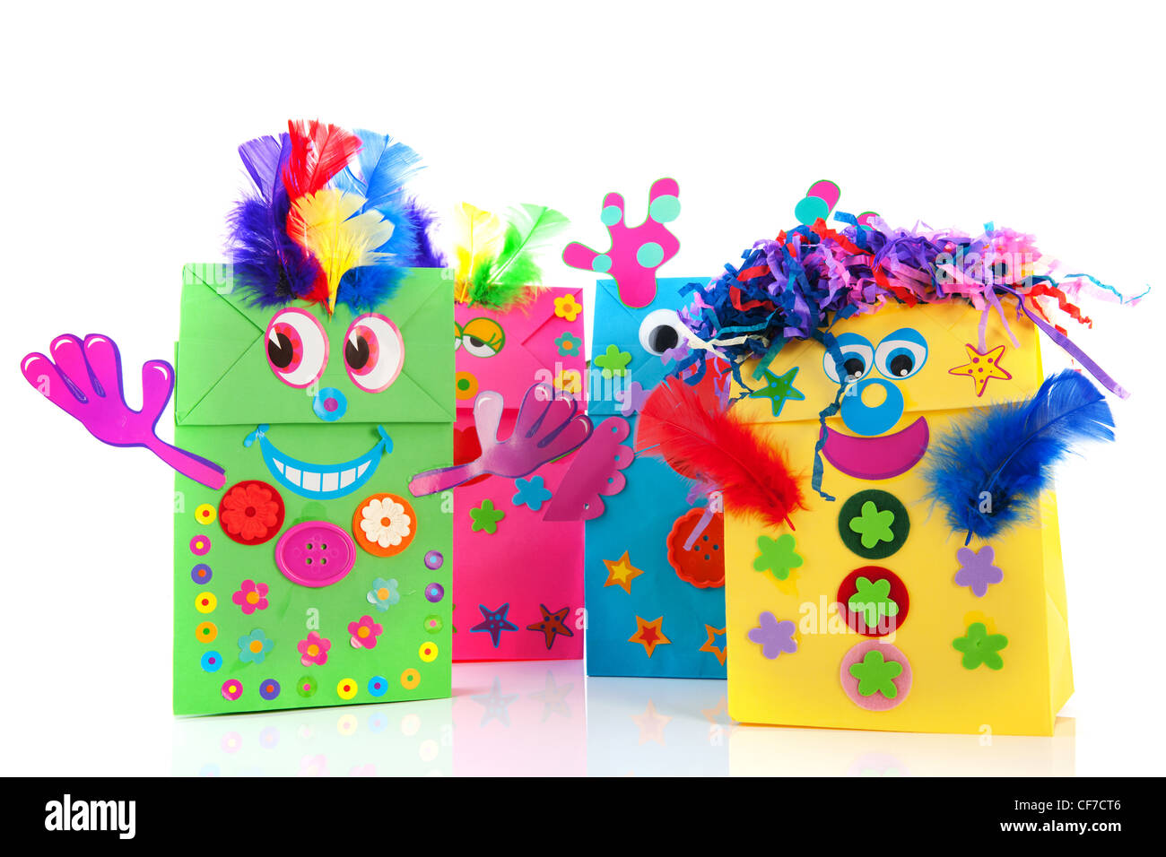 Funny colorful paper bags with faces isolated over white background ...