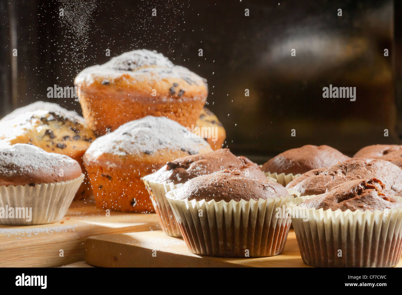 Falling sugar on vanilla muffins Stock Photo - Alamy