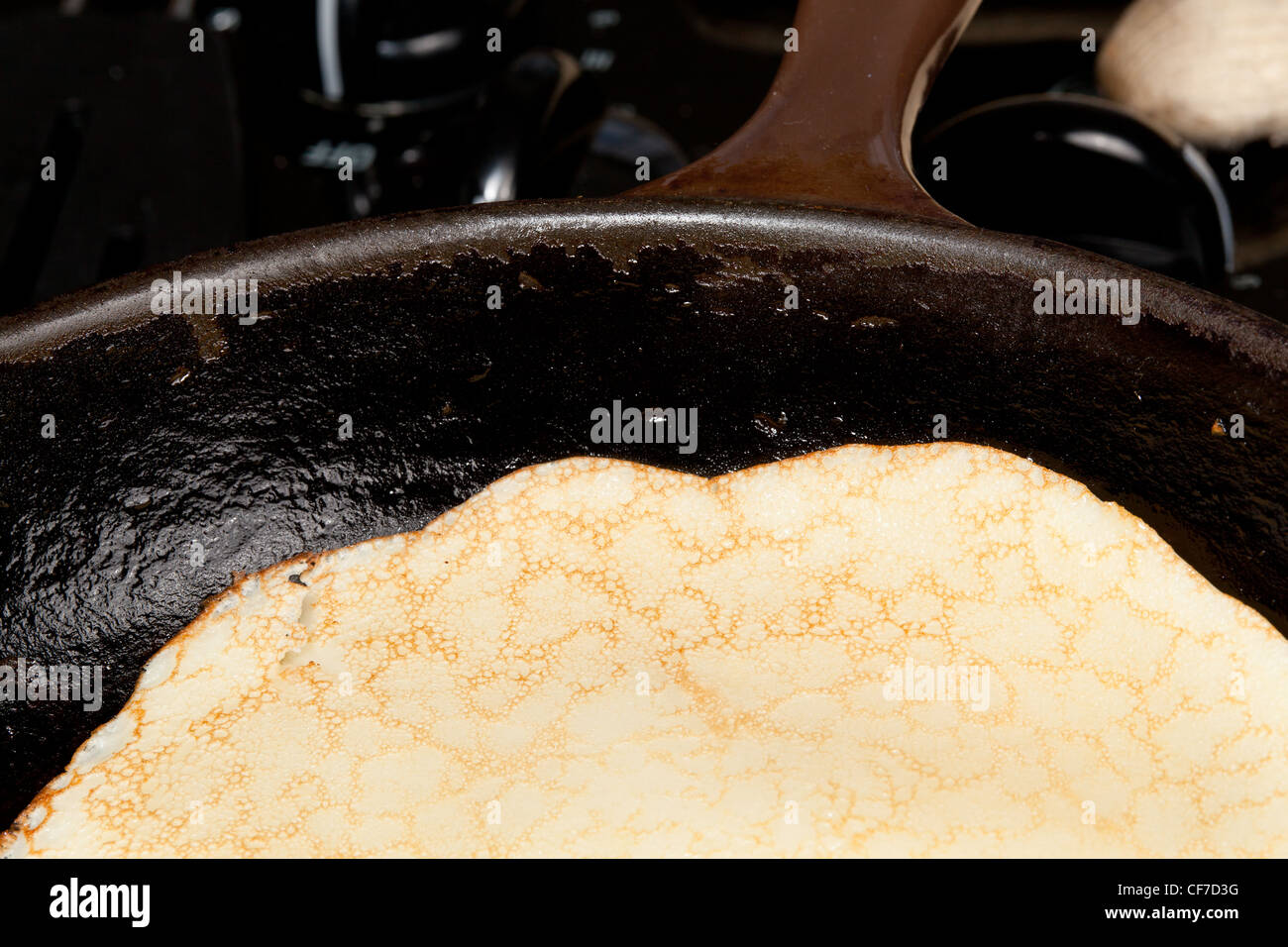 Frying pan on gas stove with pancake mixture being cooked Stock Photo ...