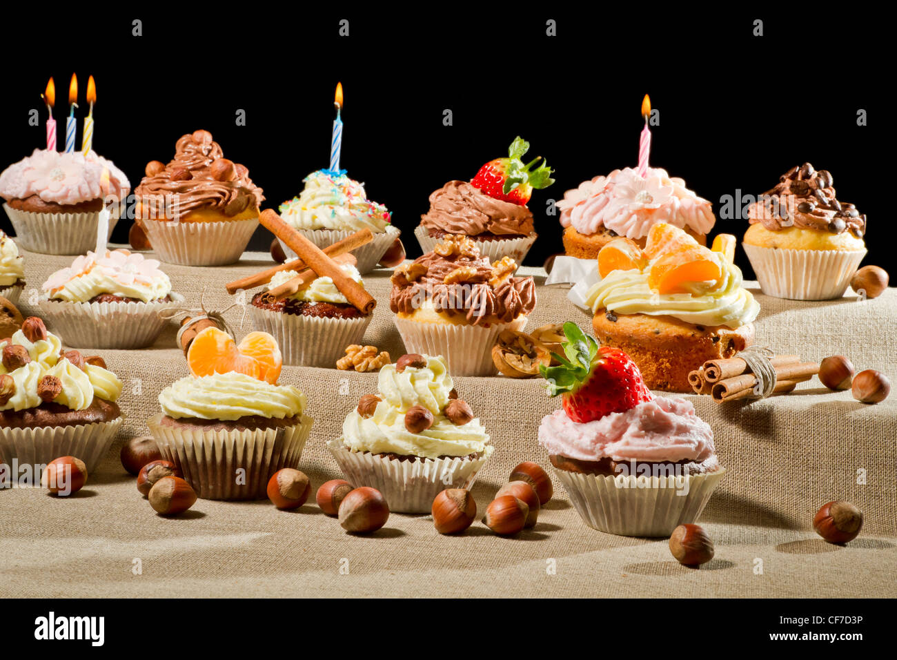 Birthday muffins with cream and nuts Stock Photo - Alamy