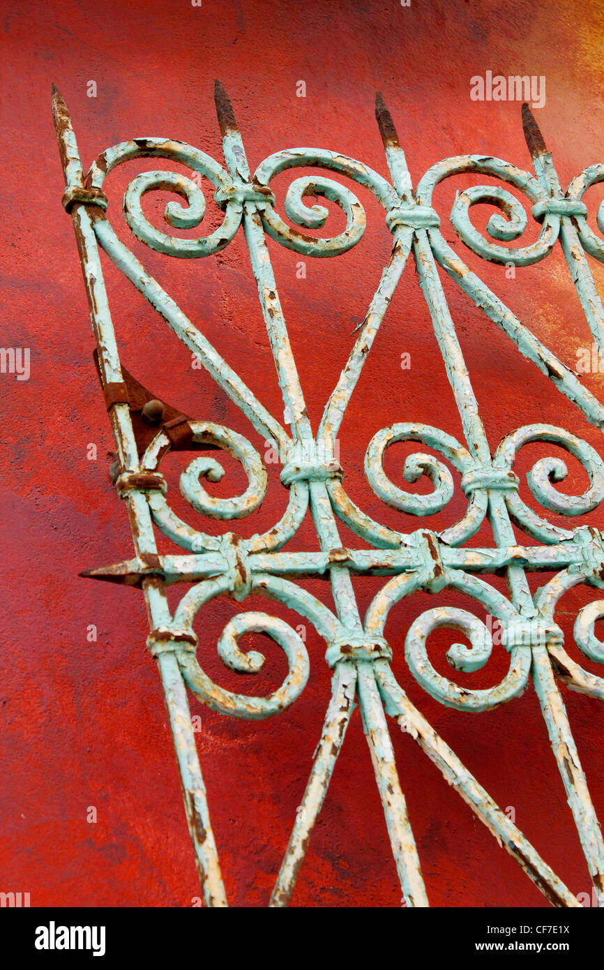 Colorful wall with wrought iron pattern in upscale neighborhood Santana ...