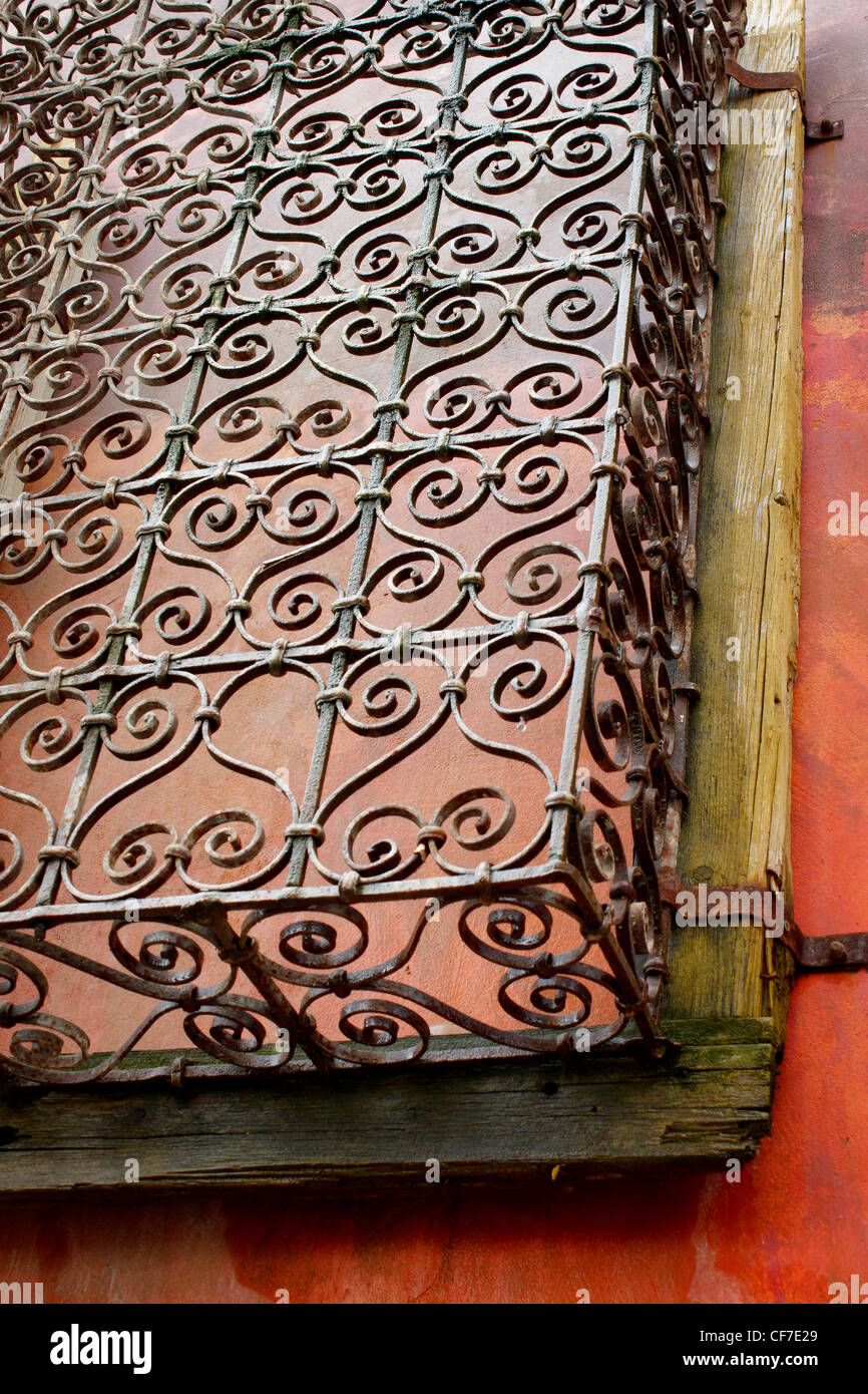 Colorful wall with wrought iron pattern in upscale neighborhood Santana ...