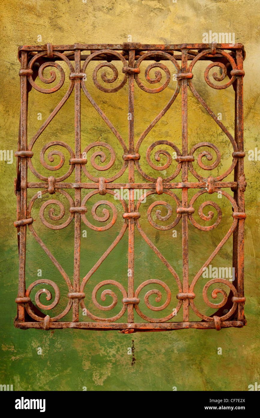 Colorful wall with wrought iron pattern in upscale neighborhood Santana ...