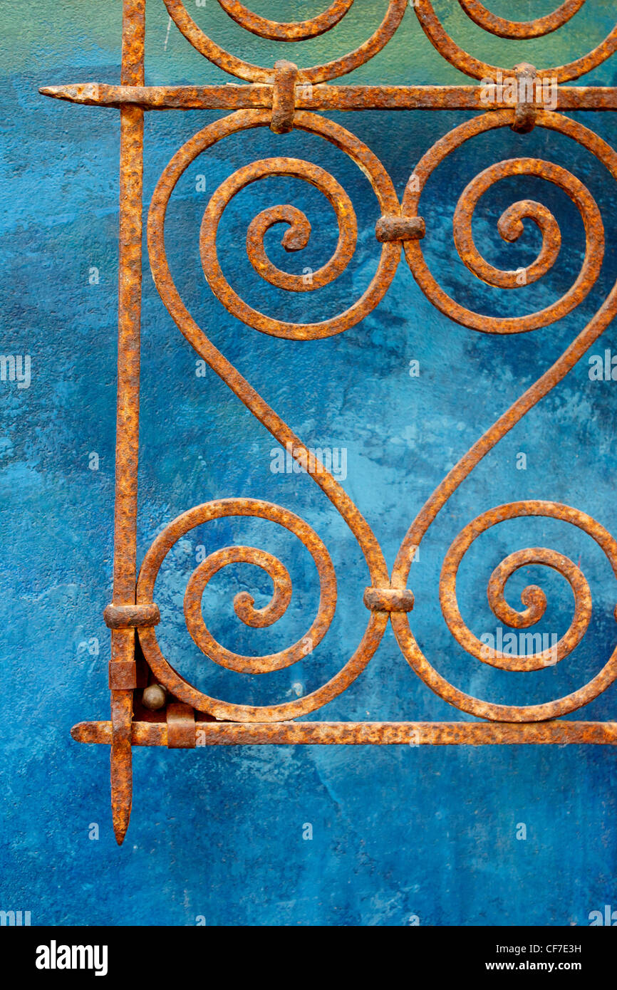 Colorful wall with wrought iron pattern in upscale neighborhood Santana ...
