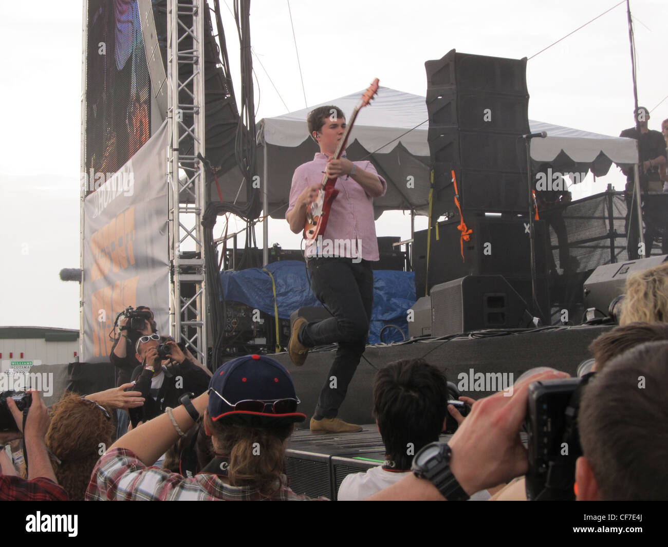 Photographers photographing the lead singer of band Surfer Blood at ...