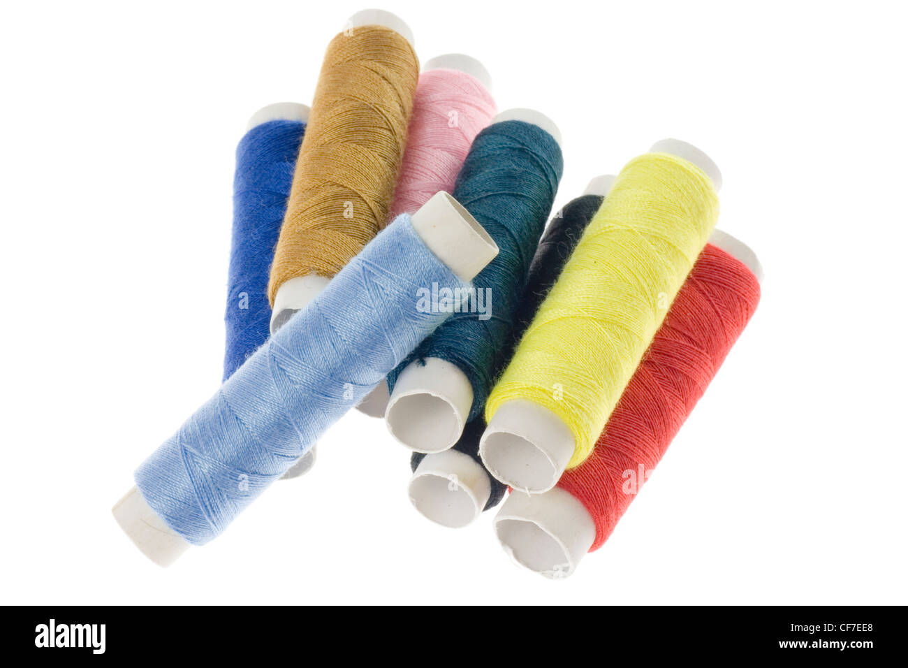 Pile of colorful sewing threads isolated on white background Stock ...