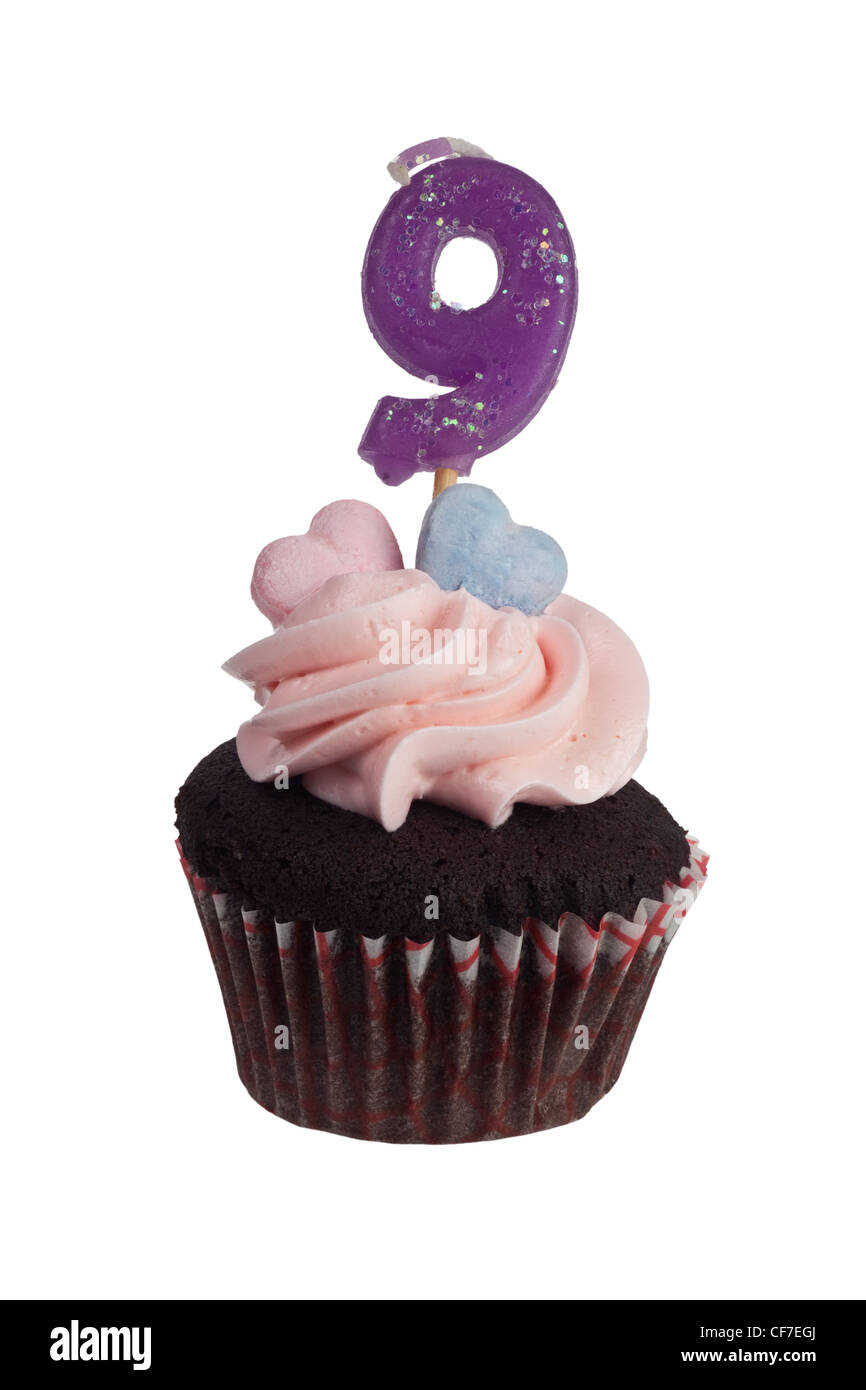 Mini cupcake with number nine candle for nine year anniversary isolated ...