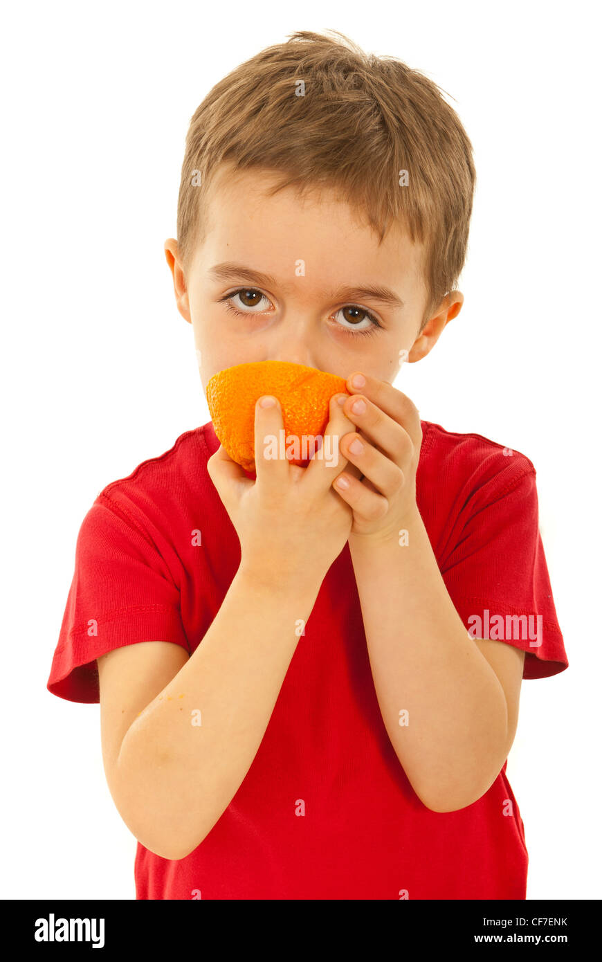 Child boy biting orange slice isolated on white background Stock Photo ...