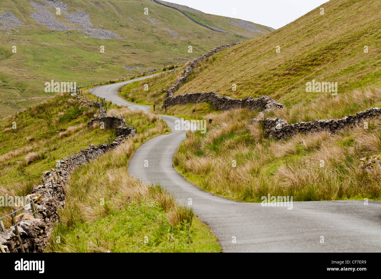 View of winding road surrounded by grass, Landscape in the Yorkshire ...