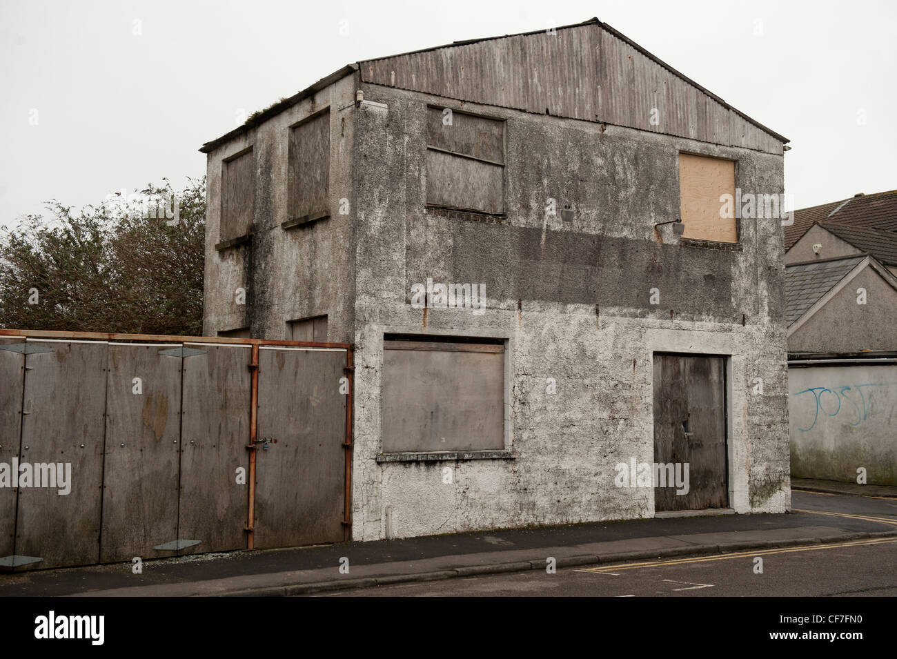 a boarded up derelict building uk Stock Photo - Alamy
