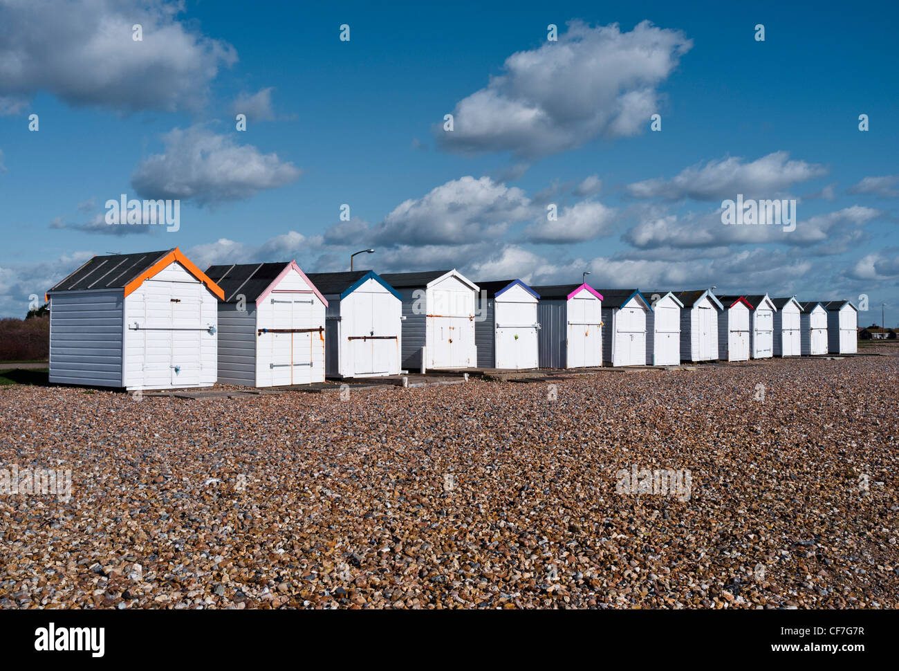 A row of white beach huts on a uk beach Stock Photo - Alamy