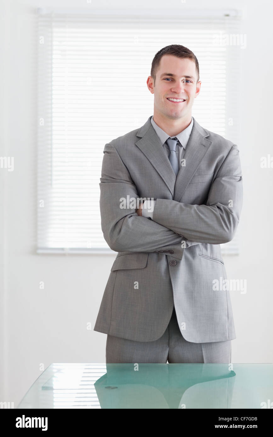 Business man with his arms folded and smiling Stock Photo - Alamy