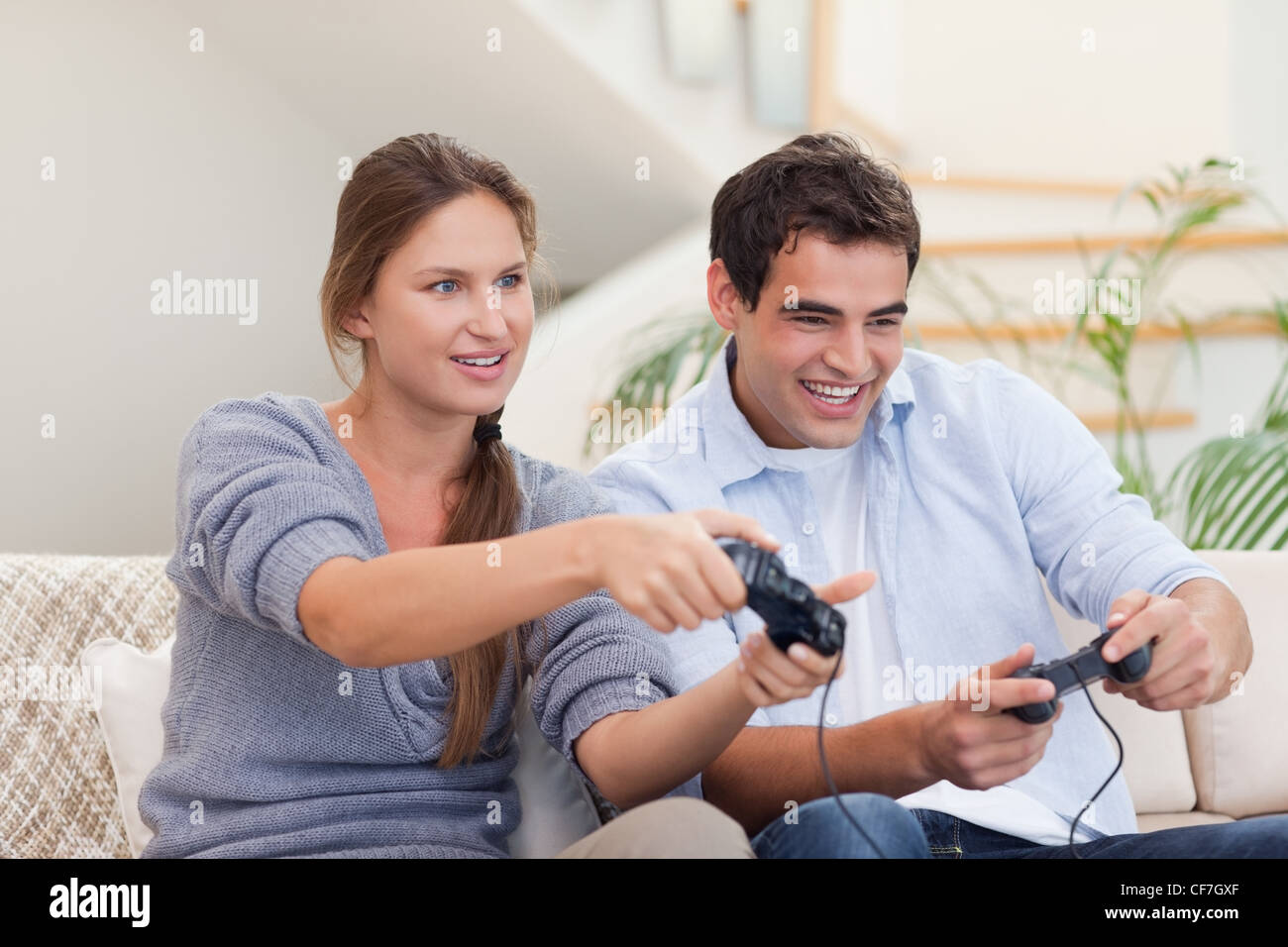 Couple playing video games Stock Photo - Alamy