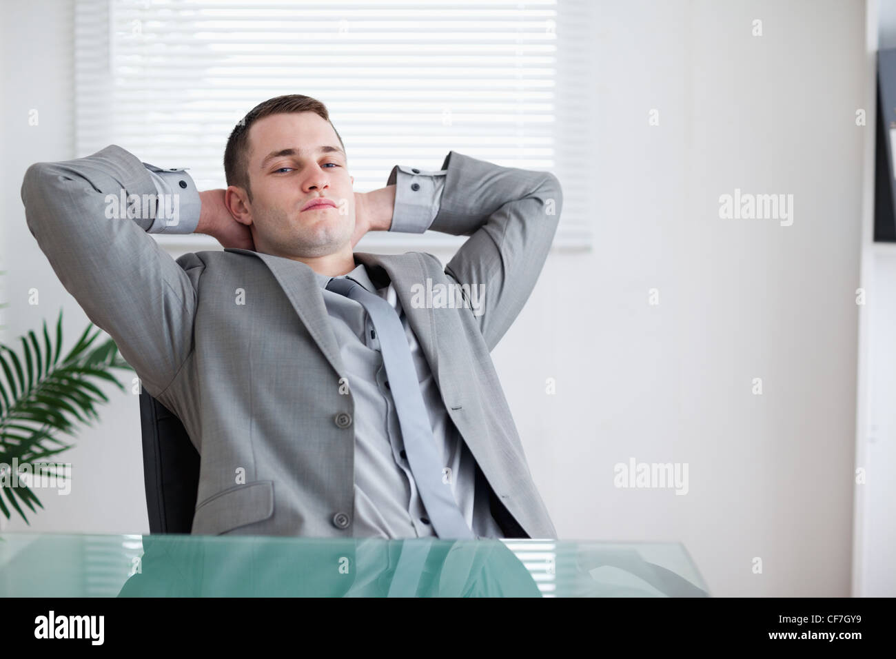 Young businessman taking a small break Stock Photo - Alamy