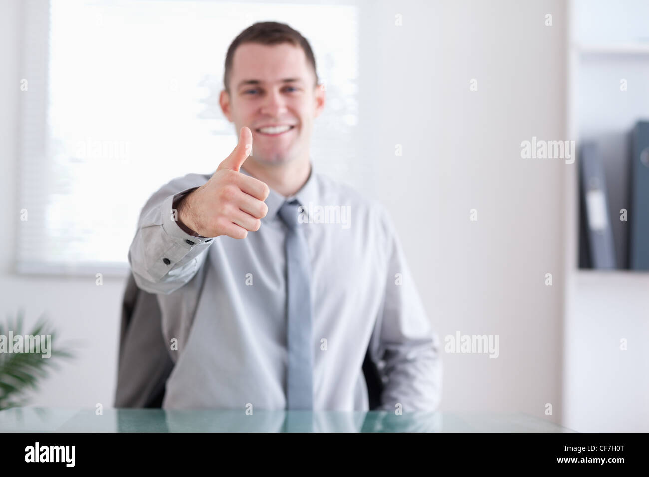 Businessman gives approval Stock Photo - Alamy