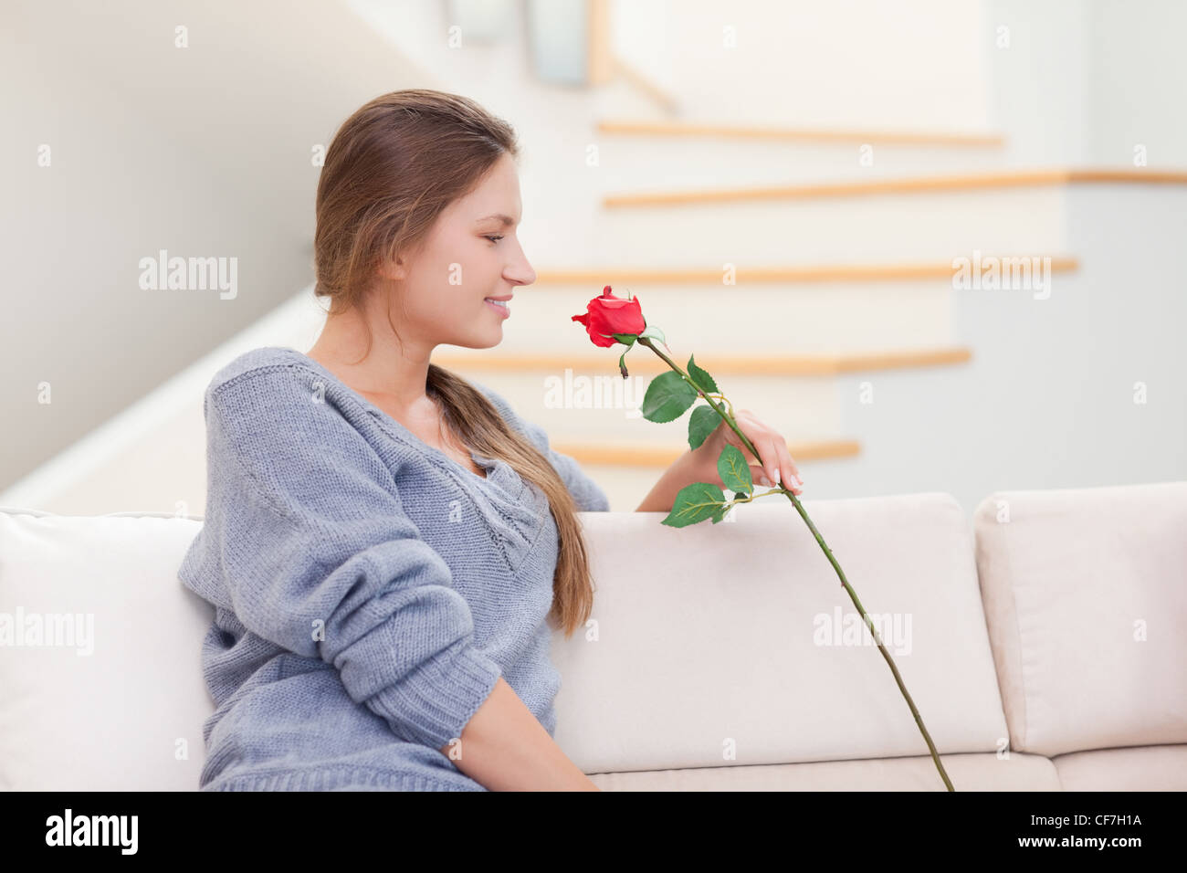Woman smelling a rose Stock Photo - Alamy