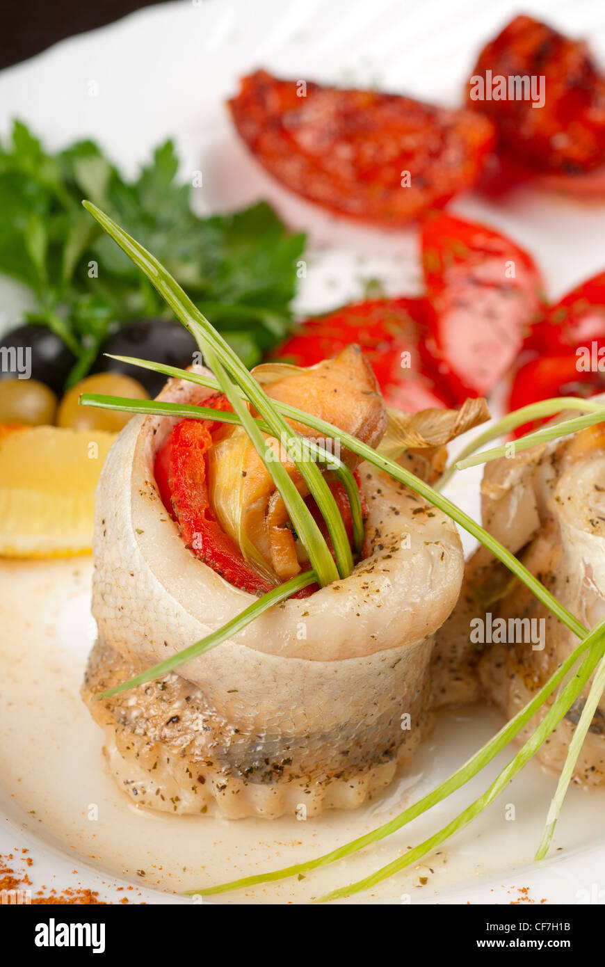fillet of pikeperch stuffed with trout fish with baked pepper, tomato ...
