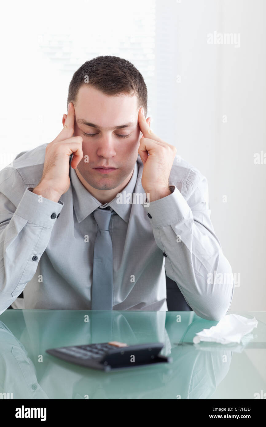Businessman not happy with his calculations Stock Photo - Alamy
