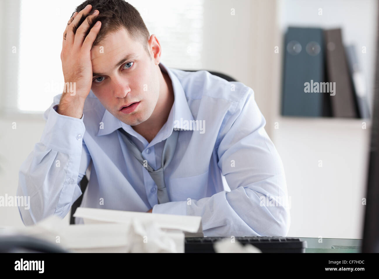 Businessman overextended with his accounting Stock Photo - Alamy