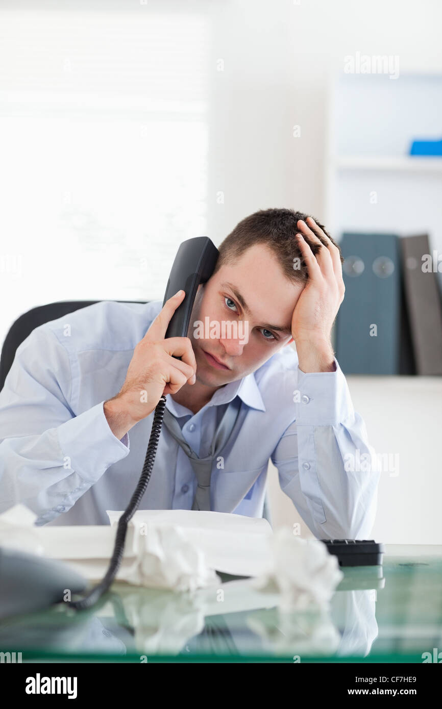 Close up of businessman trying to solve a problem on the phone Stock ...