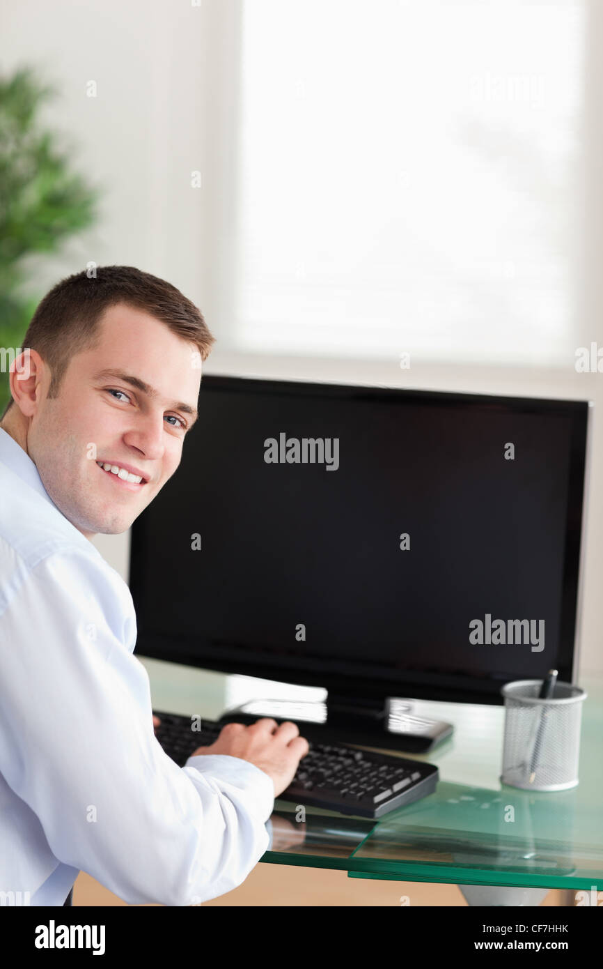Shadowing a businessman working on his computer Stock Photo - Alamy