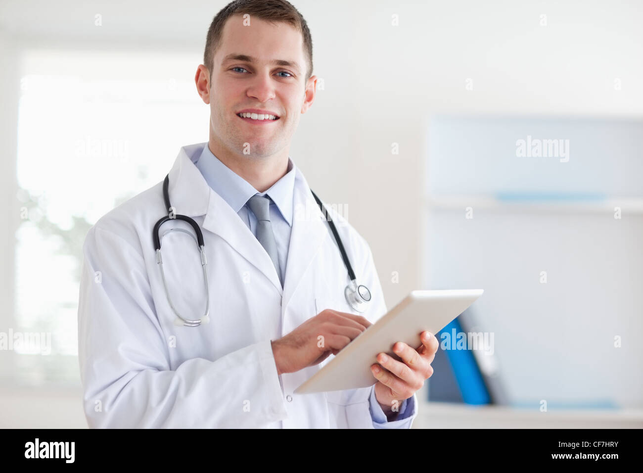 Doctor with his tablet Stock Photo - Alamy