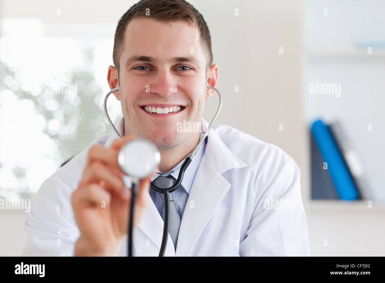 Smiling doctor with stethoscope Stock Photo - Alamy