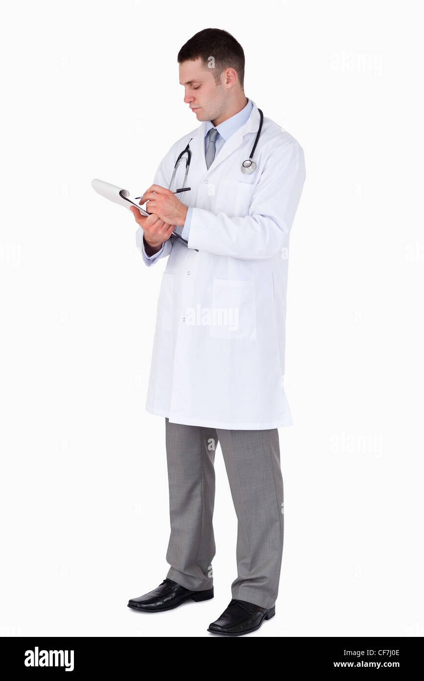 Doctor writing down notes Stock Photo - Alamy