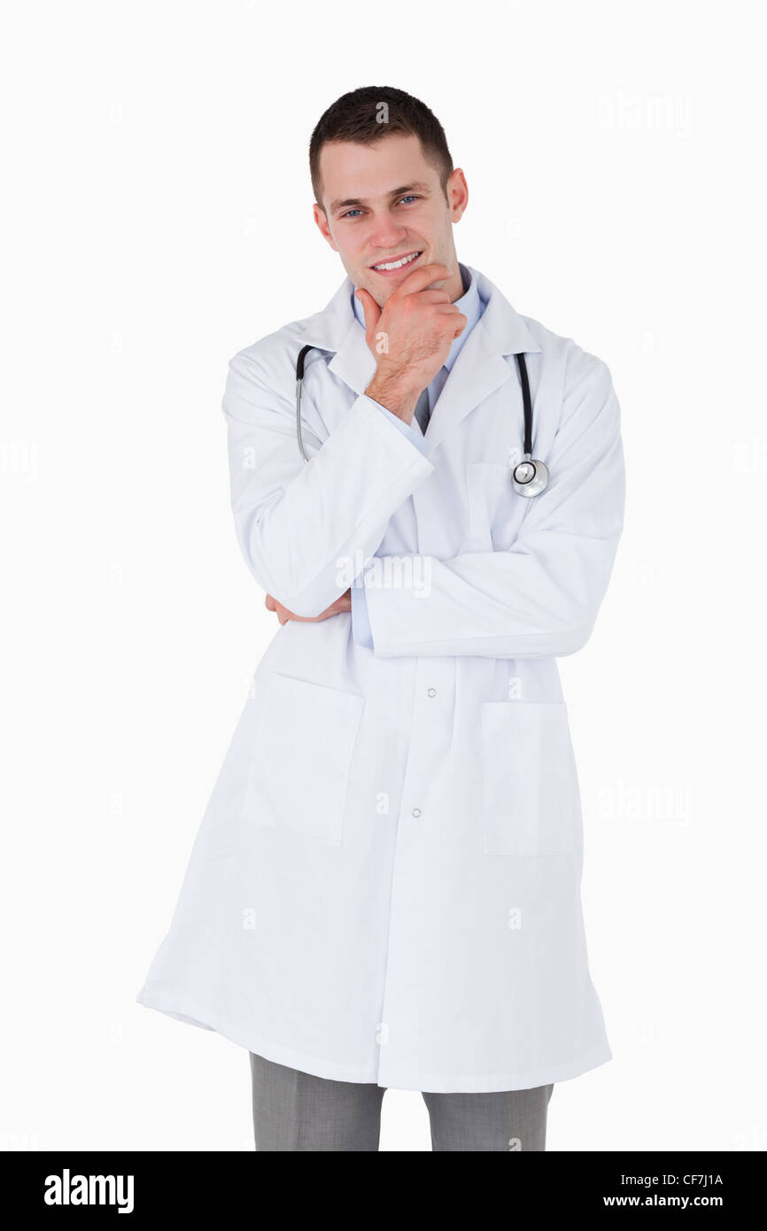 Smiling thinking doctor Stock Photo - Alamy