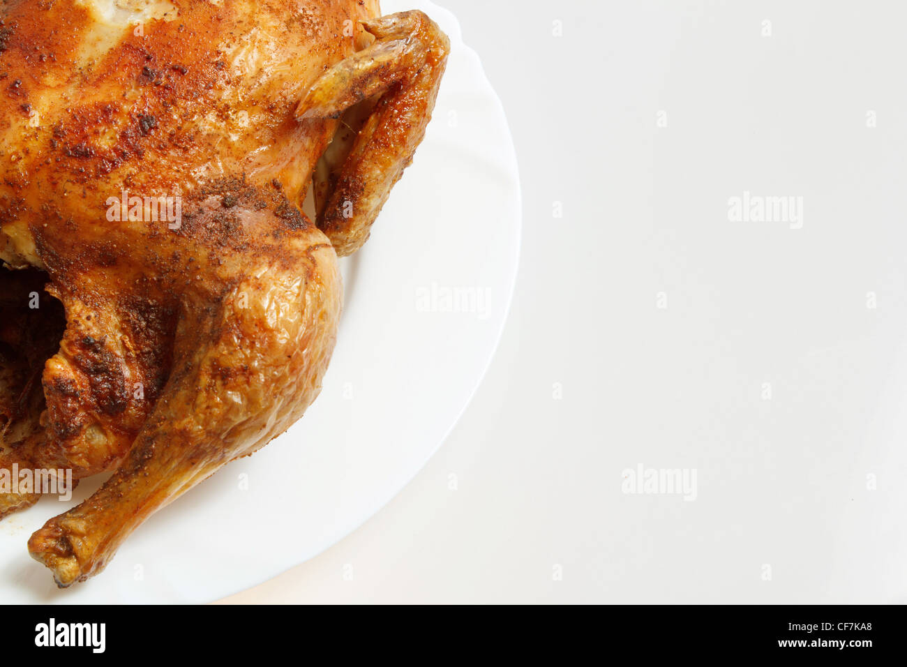 Roasted Chicken isolated on a white background Stock Photo - Alamy