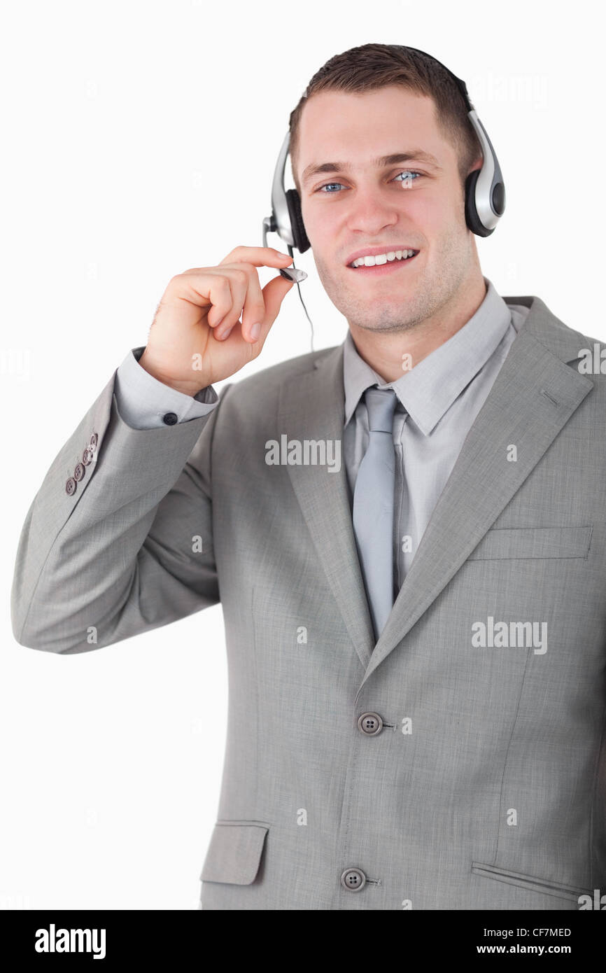 Portrait of a smiling operator using a headset Stock Photo - Alamy