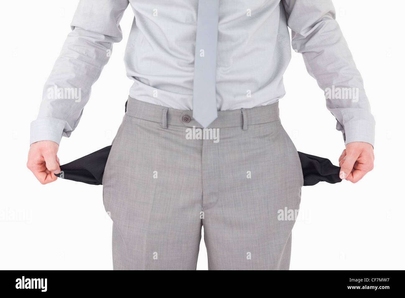 Businessman showing his empty pockets Stock Photo - Alamy